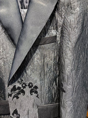 Close-up of a tuxedo jacket with floral patterns on a brocade-textured ...